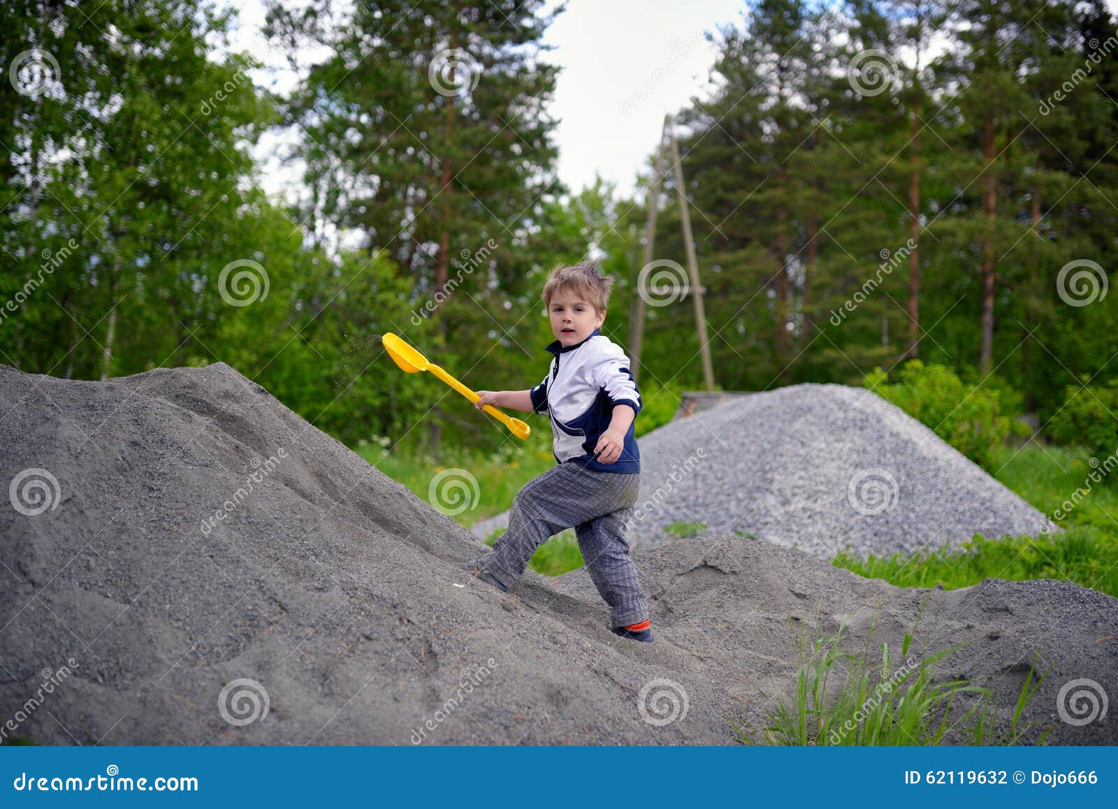 Little Boy Plays on Heap of Crushed Stone Stock Photo - Image of ...