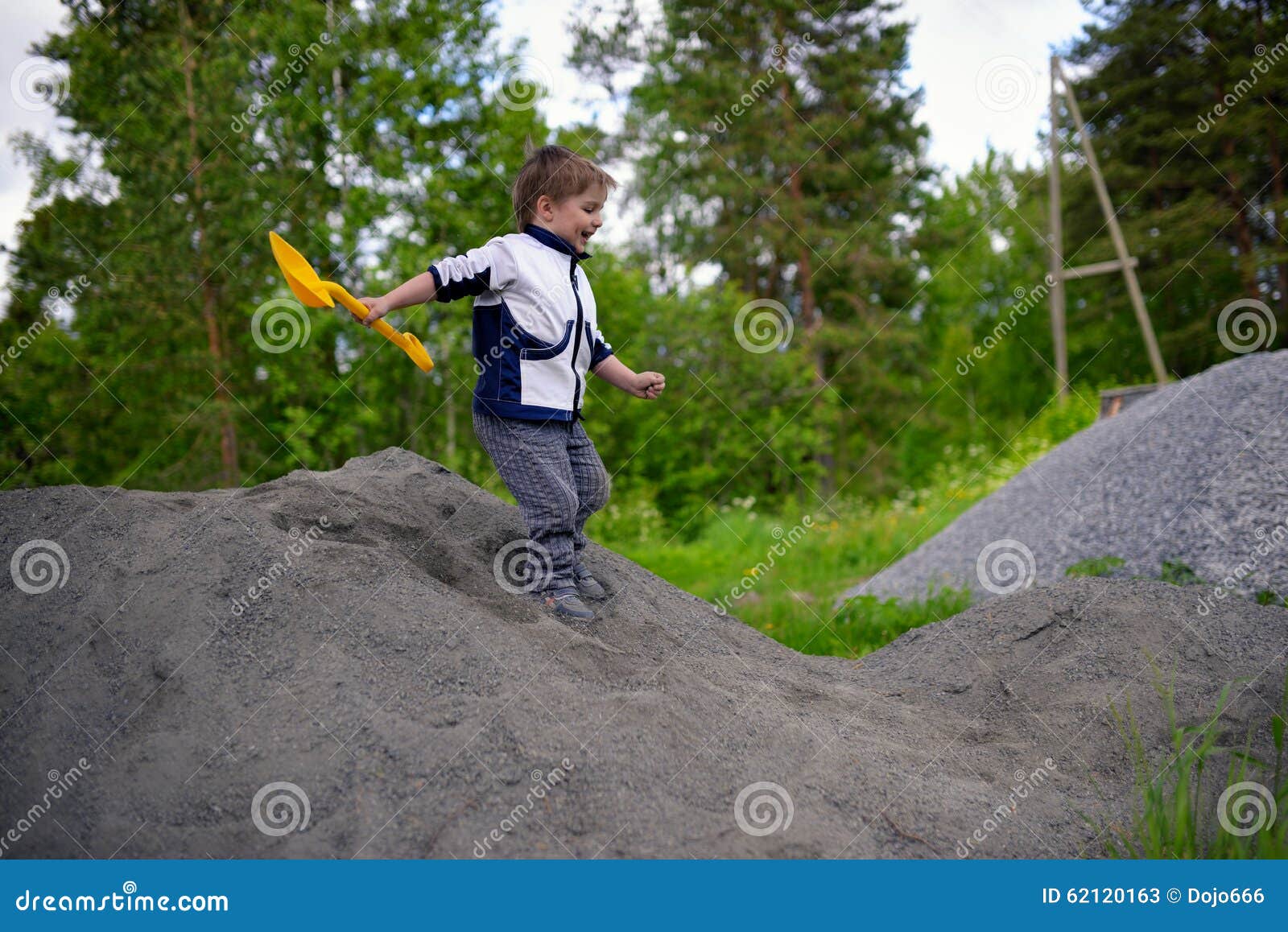 Little Boy Plays on Heap of Crushed Stone Stock Image - Image of green ...