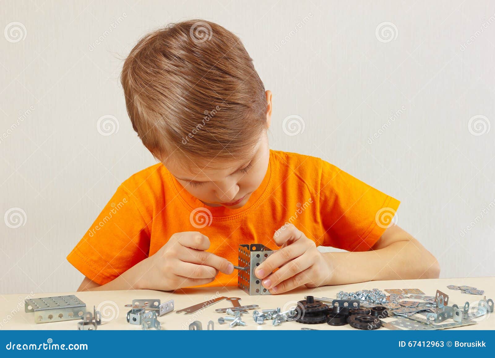 Little Boy Plays with Metal Constructor at Table Stock Image - Image of ...