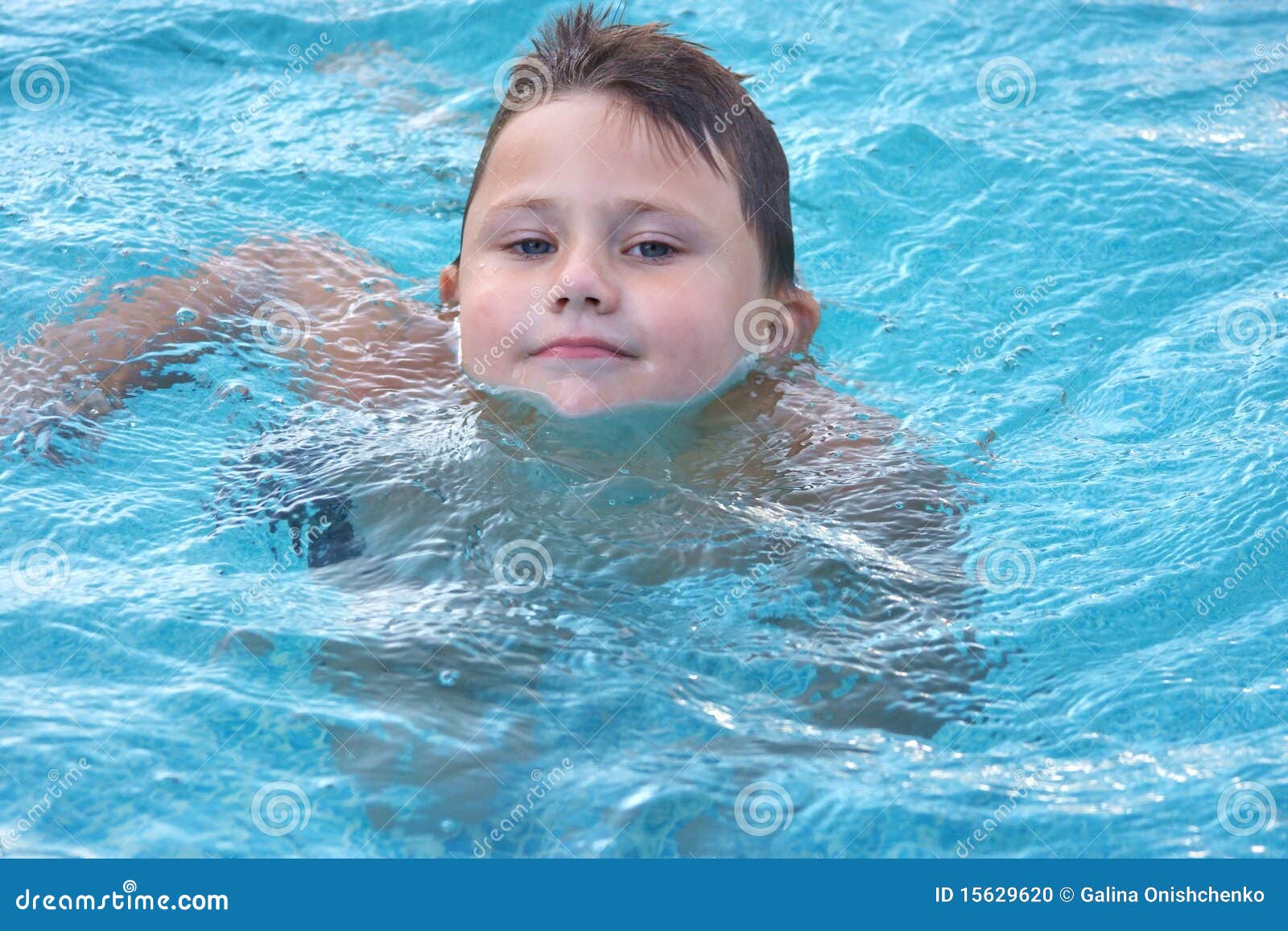A little boy in a pool stock photo. Image of plays, smile - 15629620