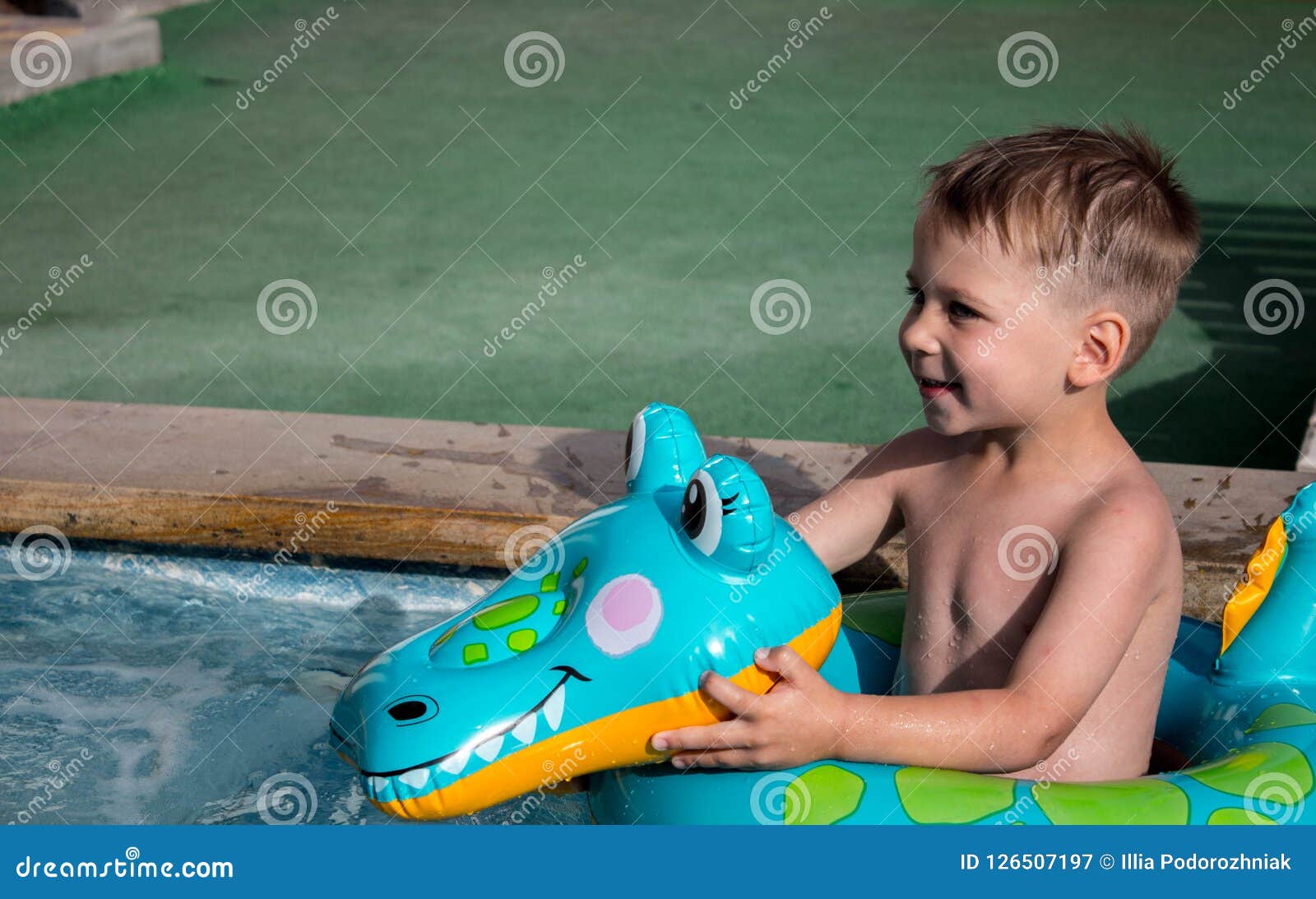 A Little Boy in the Pool on an Inflatable Lap Stock Image - Image of ...