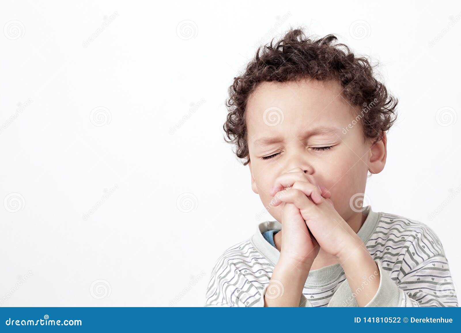 Little boy praying to God stock photo. Image of christianity - 141810522
