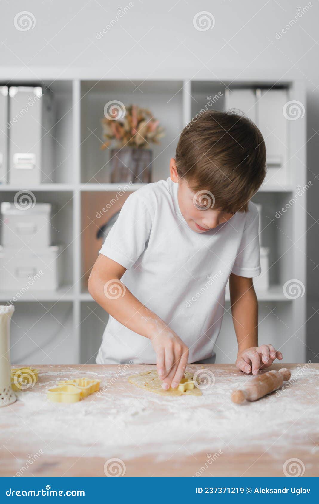 Little Boy Prepares Pastries. he Squeezes Figurines Out of Raw Dough ...