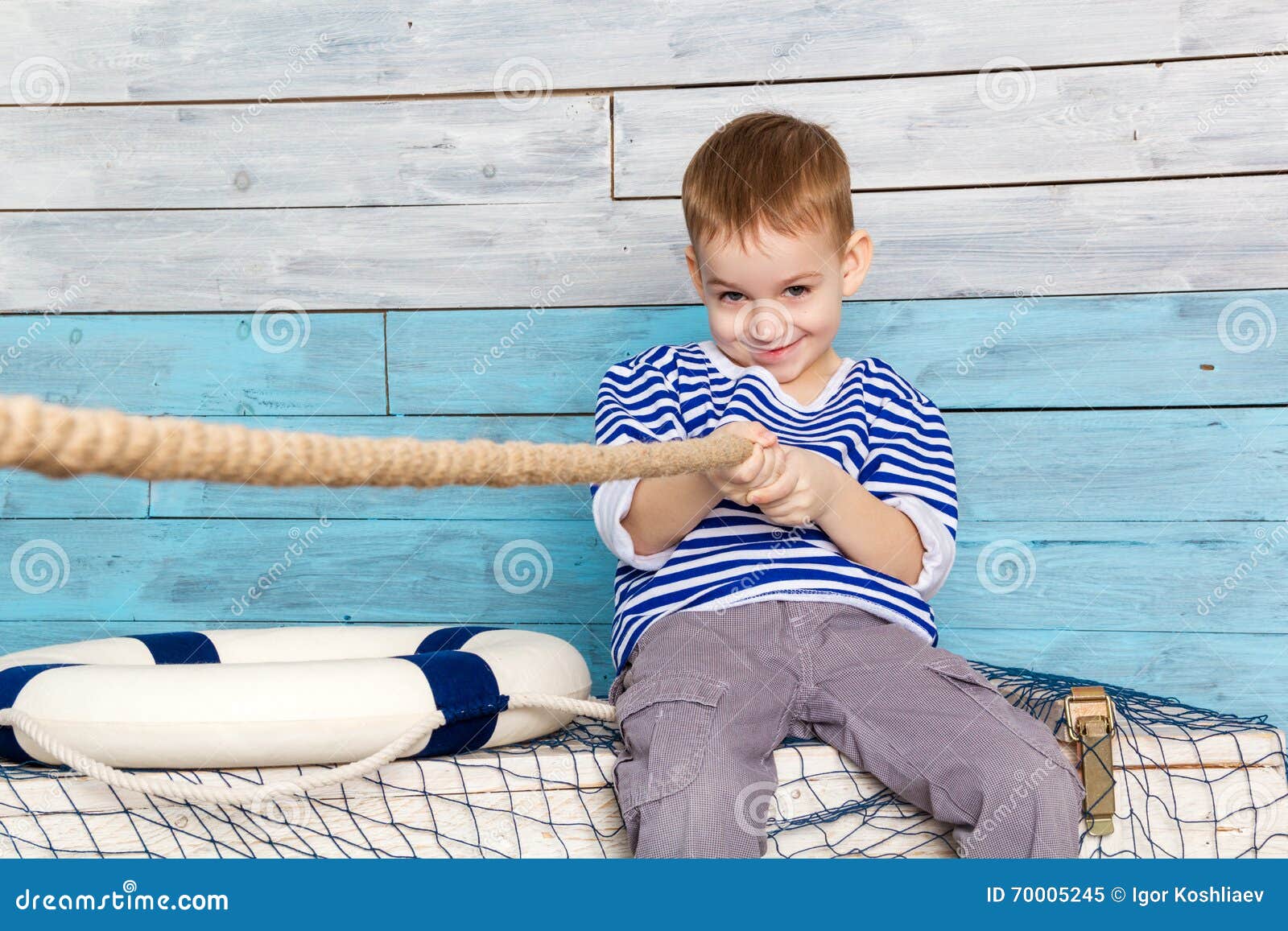Little boy pulling a rope stock image. Image of happy - 70005245