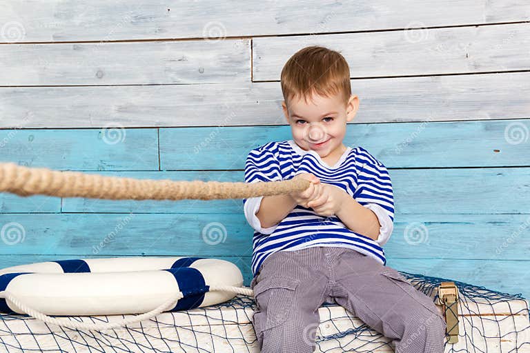 Little boy pulling a rope stock image. Image of happy - 70005245