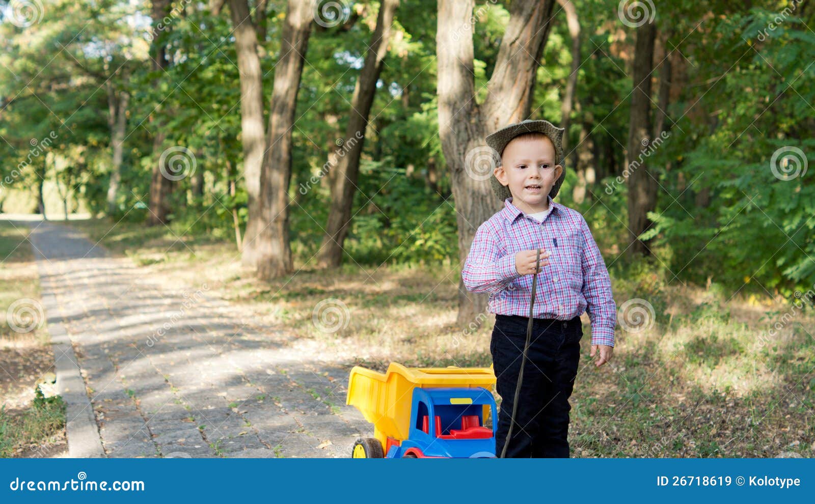 Little Boy Pulling A Toy Truck Stock Image - Image of outdoors ...