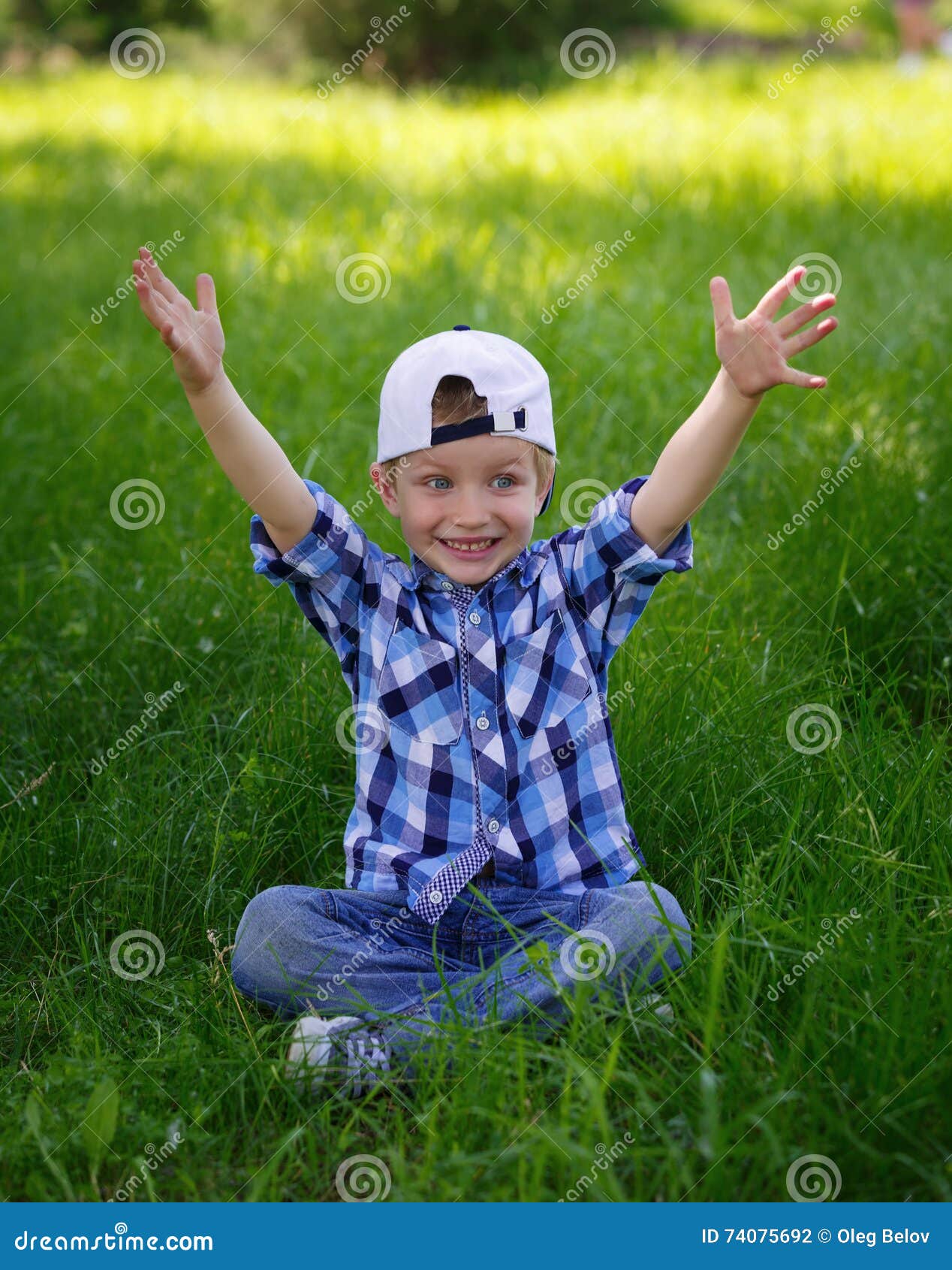 Little Boy Pulls Hands Upwards Stock Photo - Image of casual, outdoors ...