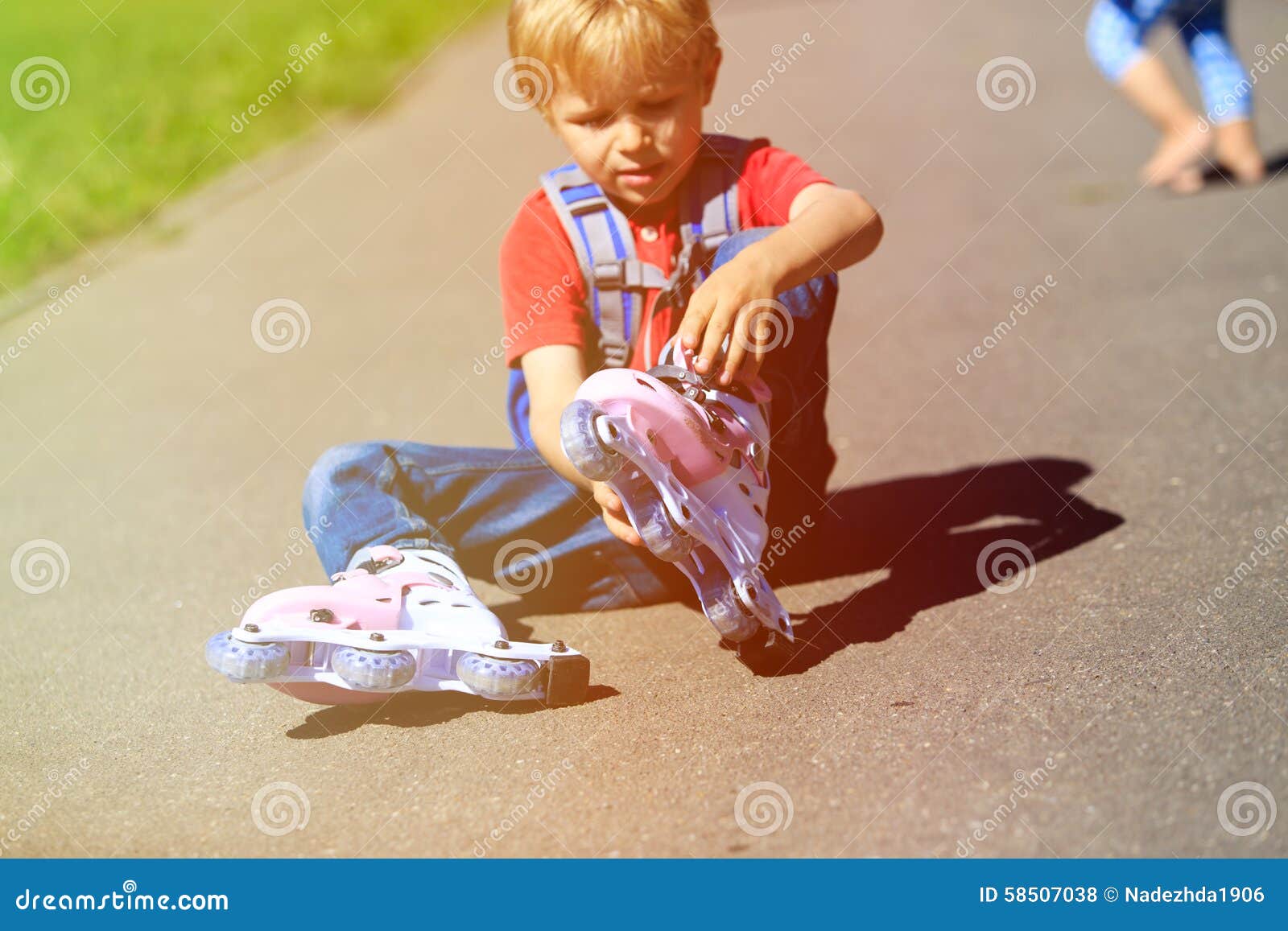 Little Boy Put on Roller Skates Outdoors Stock Photo - Image of little ...