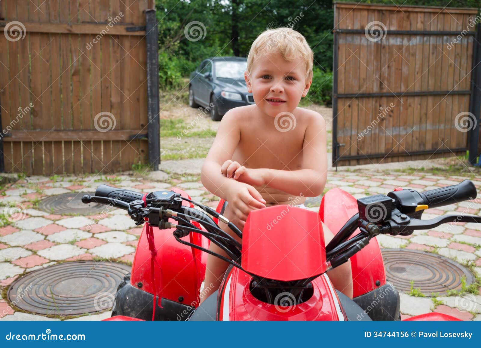 Little Boy on a Quad Bike Stands Stock Photo - Image of fence, leisure ... Little Boy on a Quad Bike Stands Stock Photo - Image of fence, leisure ...