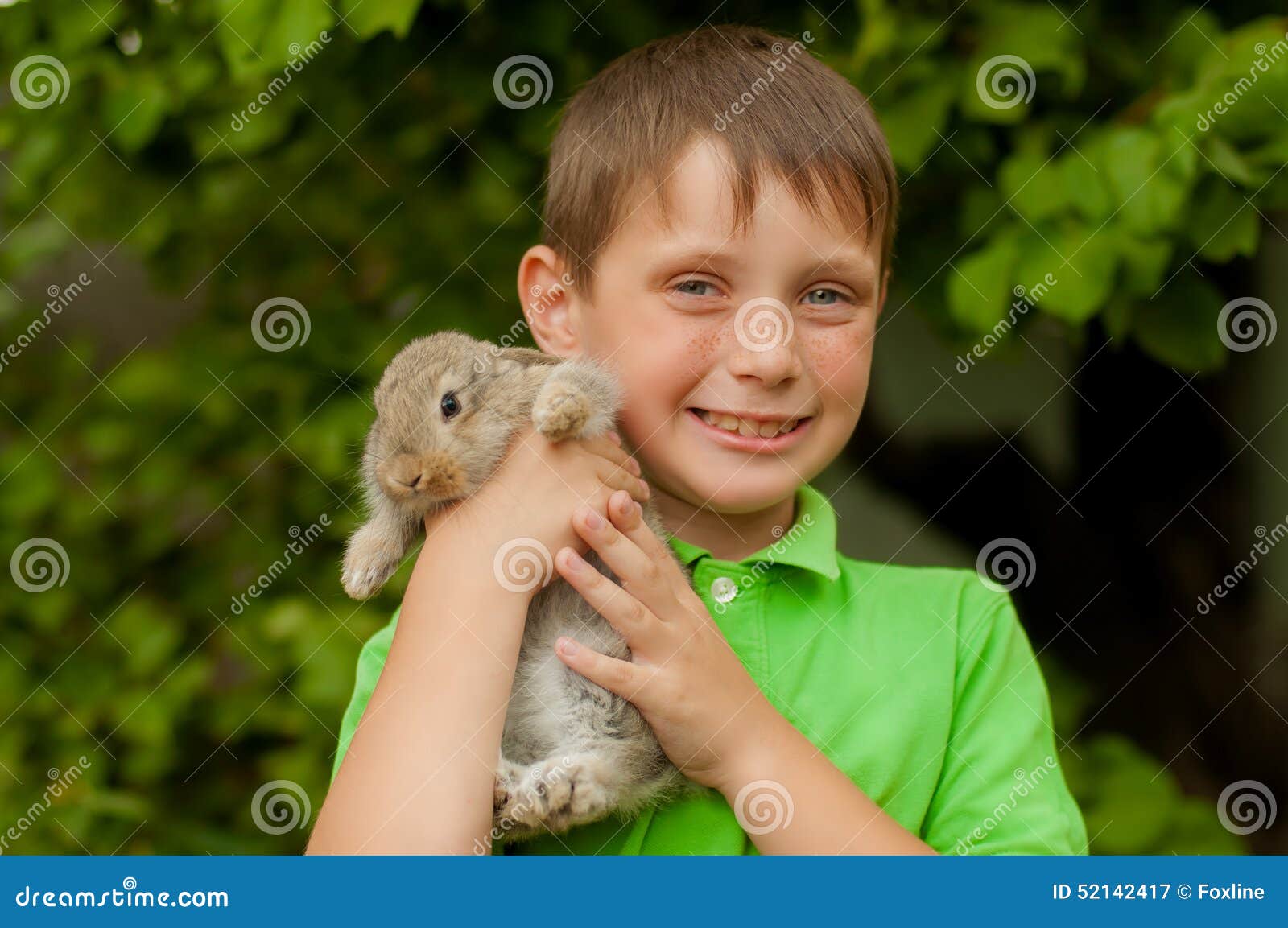 The Little Boy with a Rabbit in the Hands Stock Image - Image of green ...