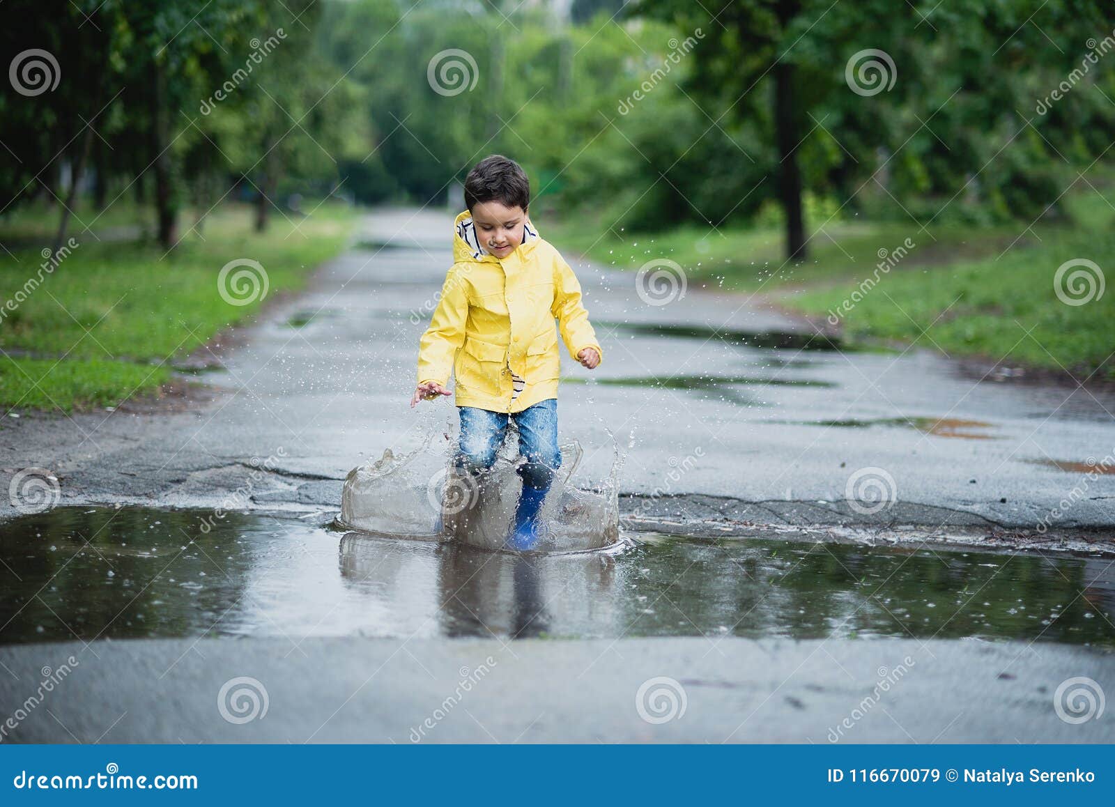 Little Boy Playing in Puddle Stock Image - Image of raincoat, splash ...