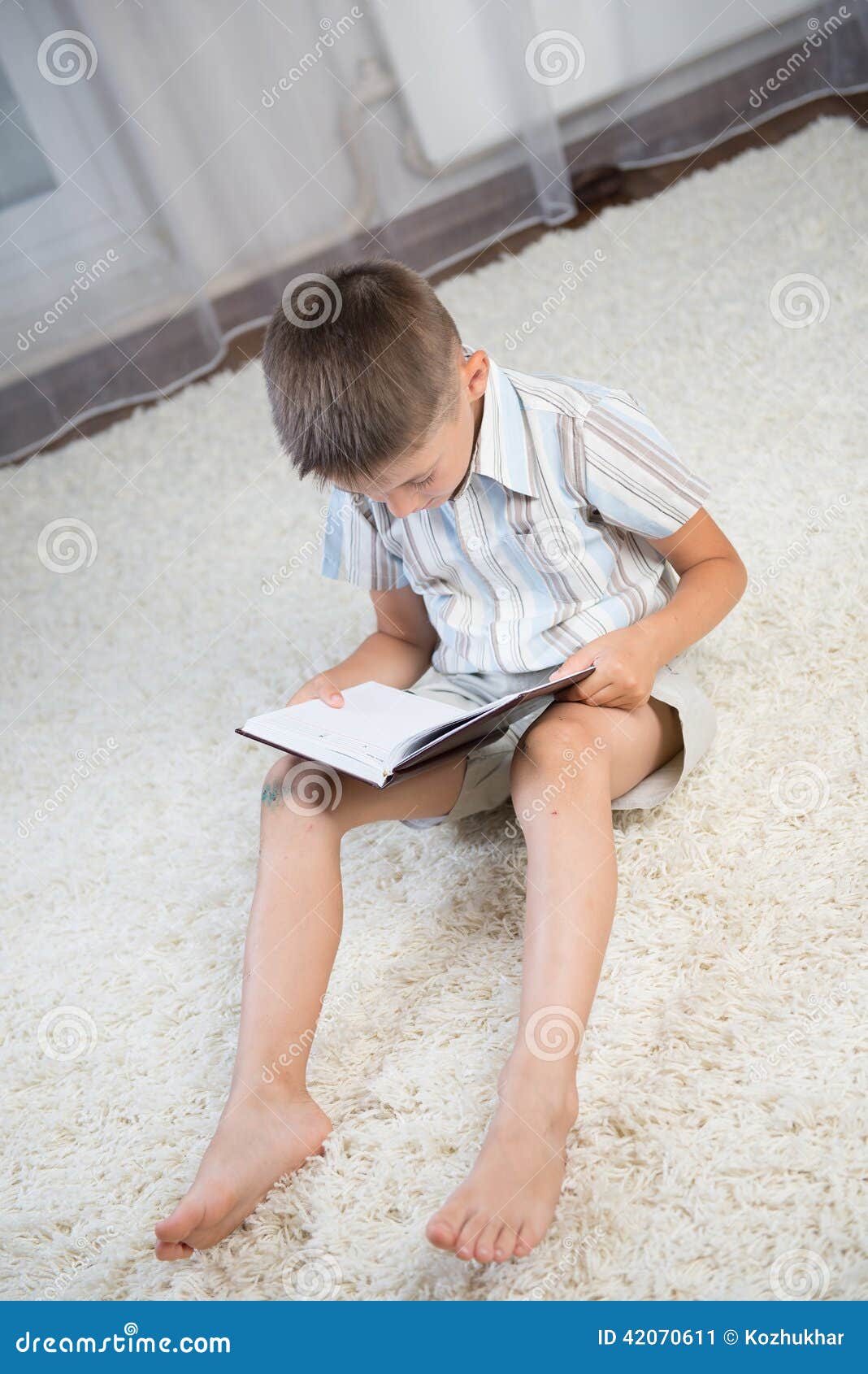 Little boy reading book stock image. Image of smiling - 42070611