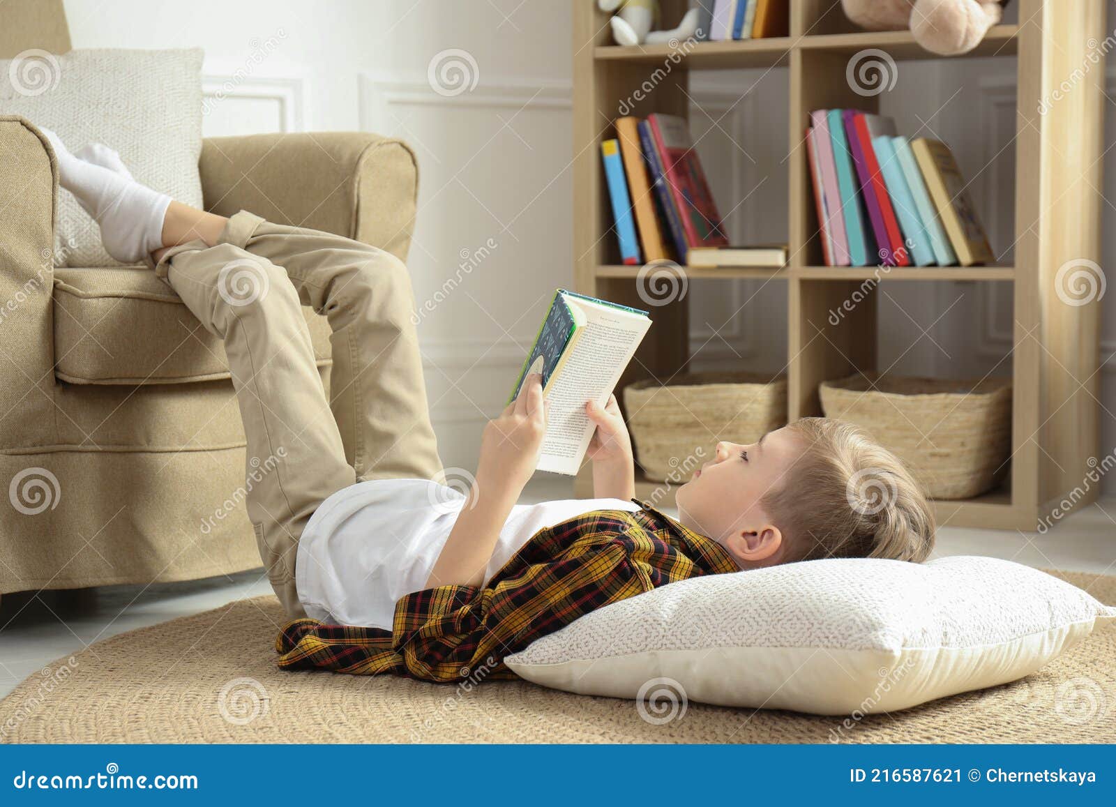 Little Boy Reading Book on Floor at Home Stock Image - Image of person ...