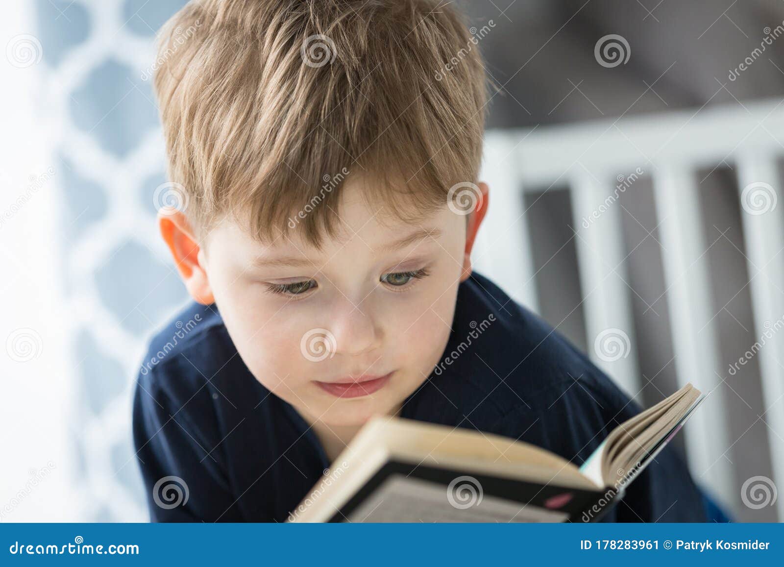 Little Boy Reading a Book at Home Stock Image - Image of eyes ...