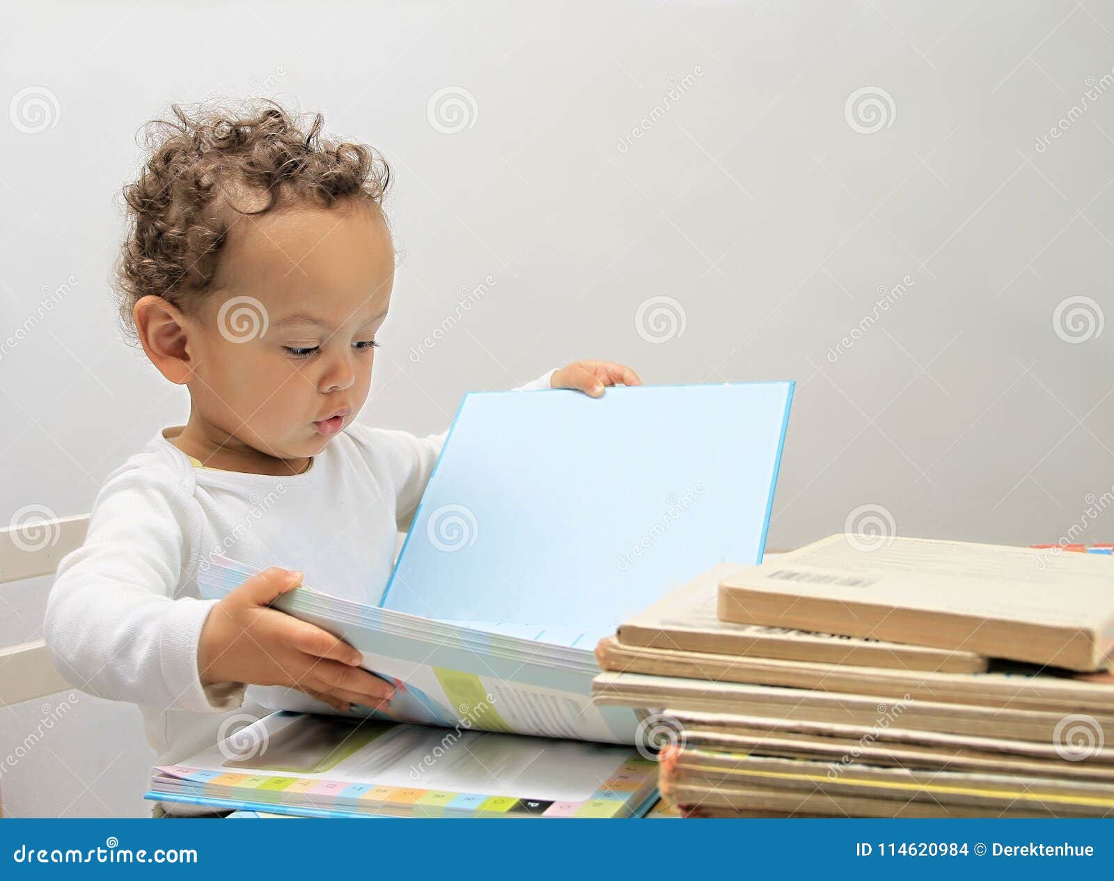 Little boy reading a book stock photo. Image of preschool - 114620984