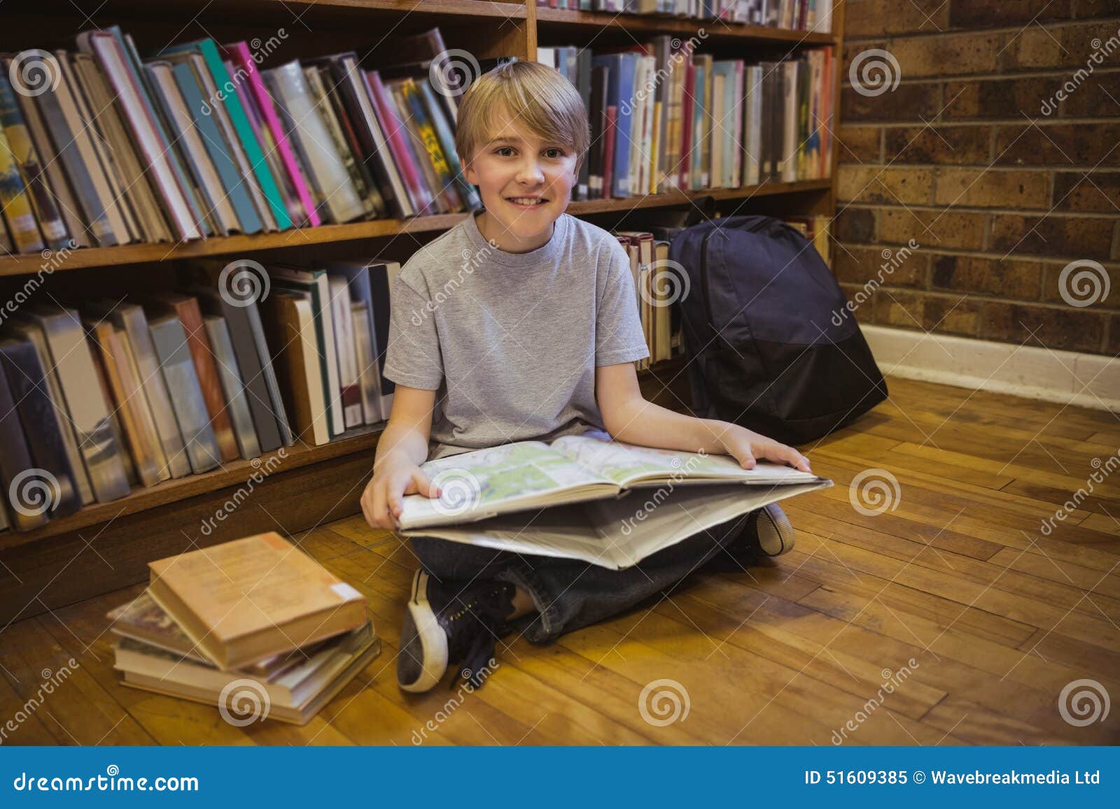 Little Boy Reading on Library Floor Stock Image - Image of pupil ...