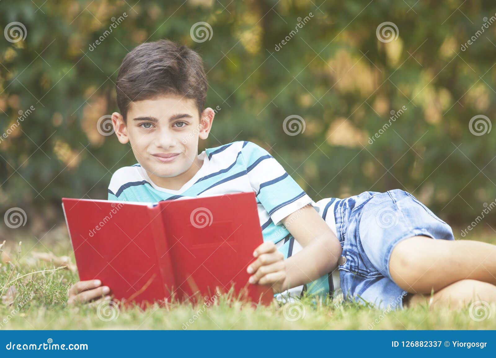 Little Boy Reading Outdoors Stock Image - Image of childhood, concept ...