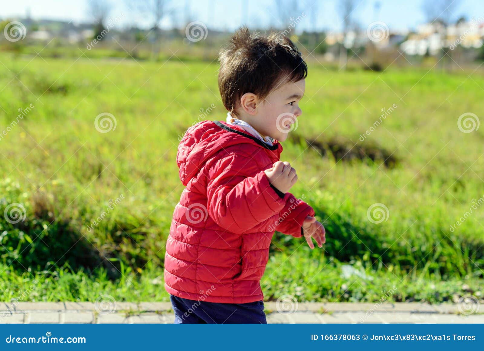 Little boy with red jacket stock image. Image of people - 166378063