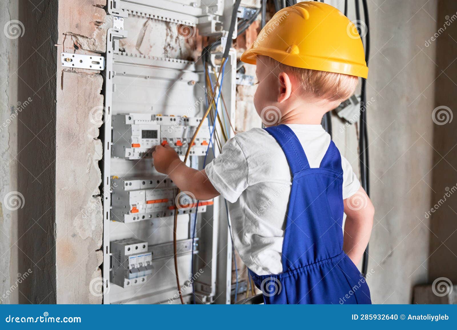 Little Boy Repairing Electrical Control Panel at Home. Stock Photo ...