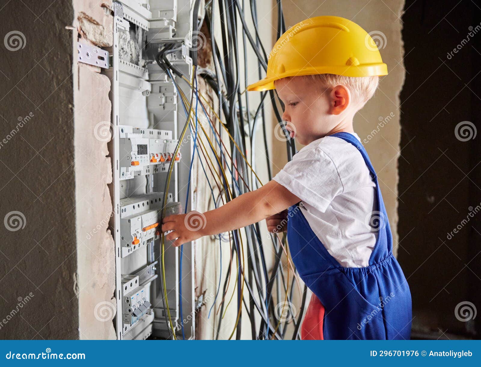 Little Boy Repairing Electrical Control Panel at Home. Stock Photo ...