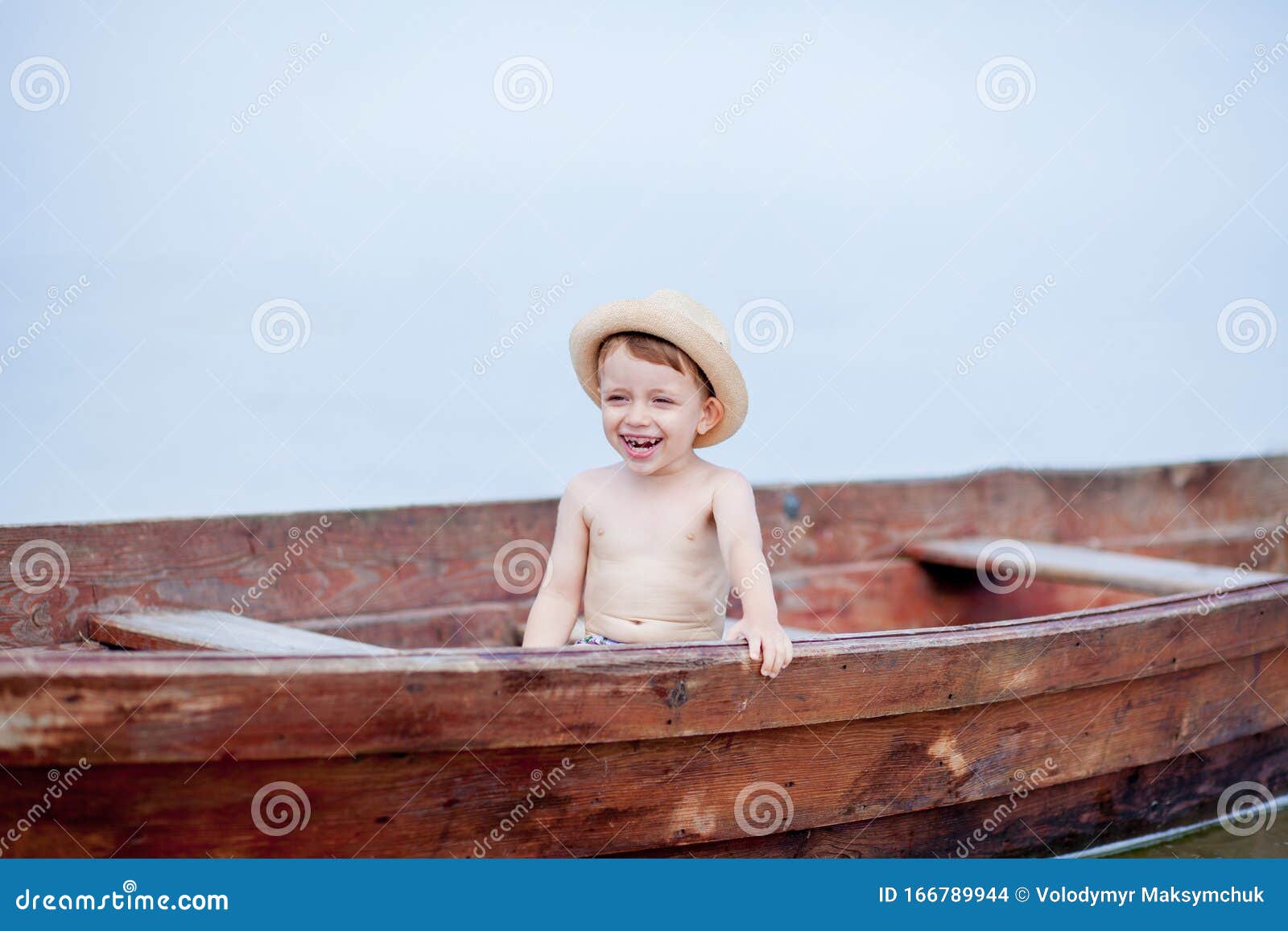 Little Boy is Resting in a Boat on the Lake Stock Photo - Image of pond ...