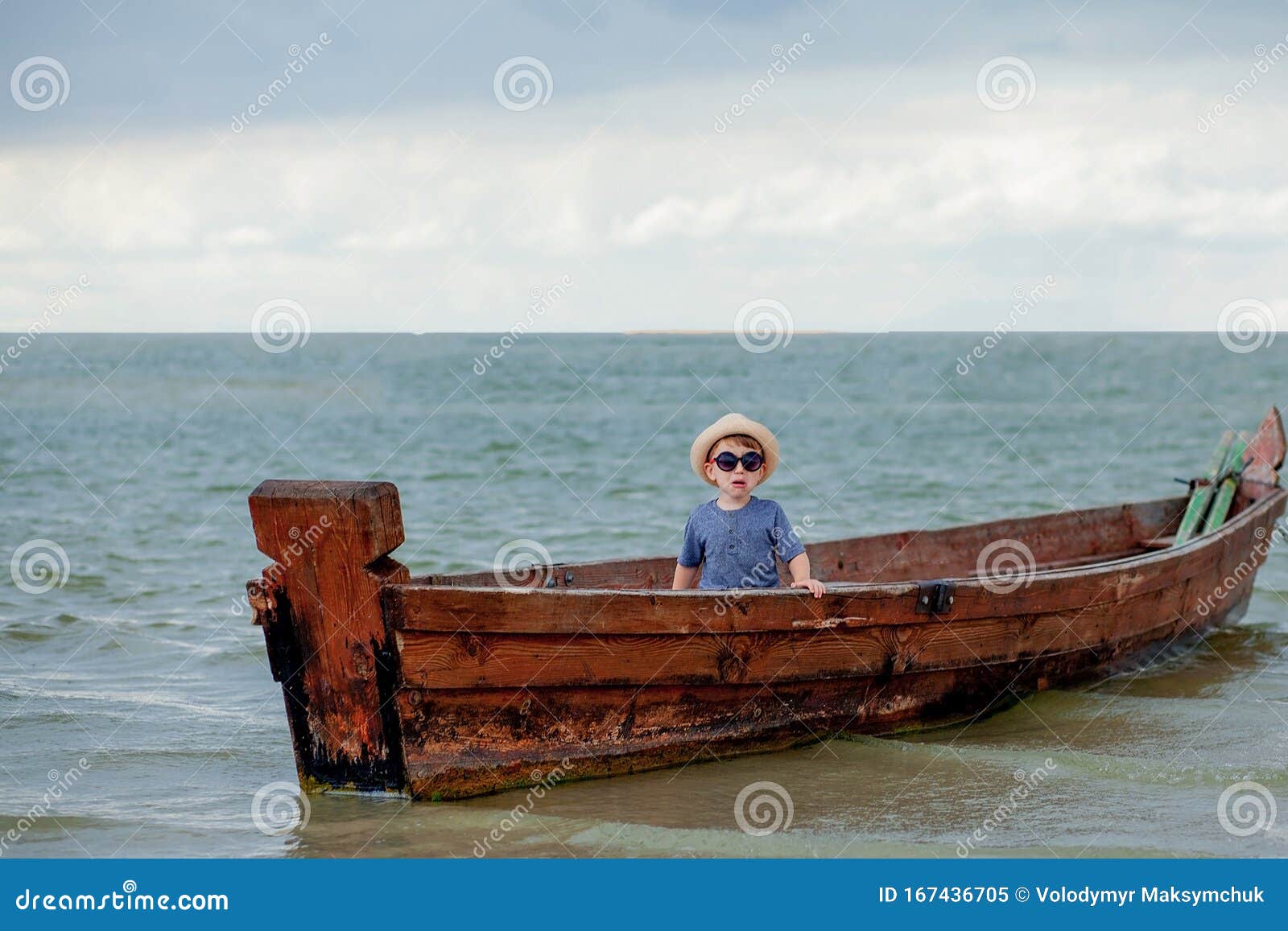 Little Boy is Resting in a Boat on the Lake Stock Image - Image of ...