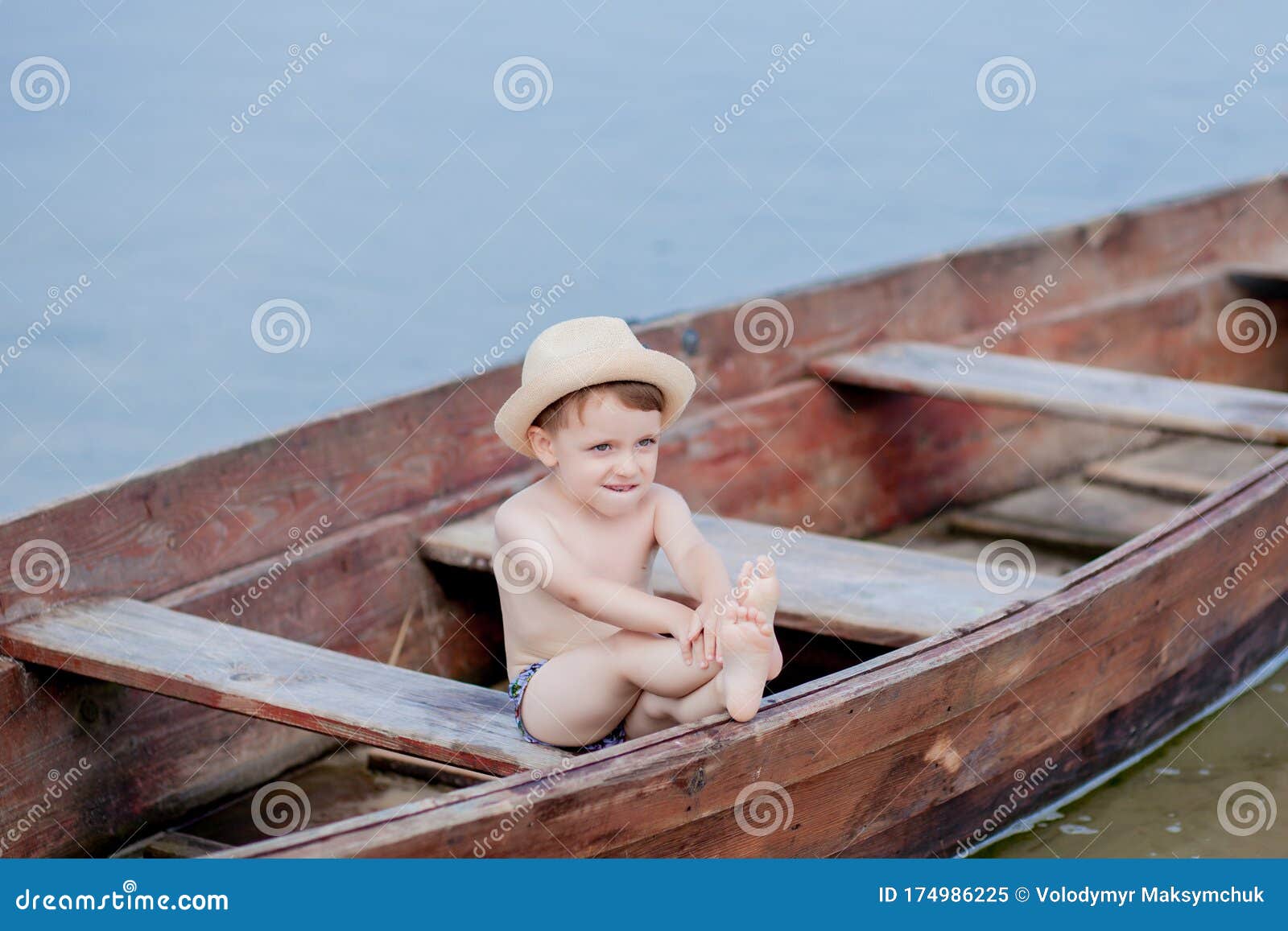 Little Boy is Resting in a Boat on the Lake Stock Image - Image of ...