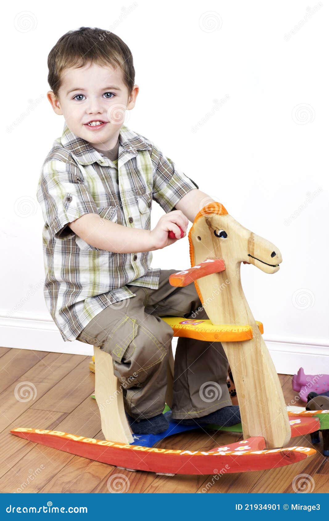 Little Boy Riding a Rocking Horse Stock Image - Image of colorful ...