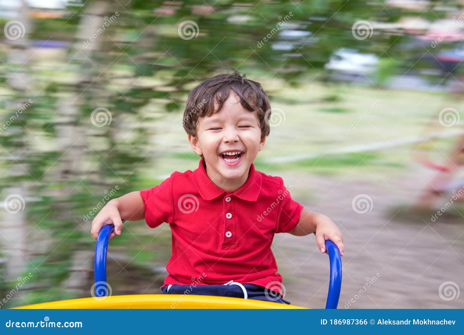Little boy riding a swing stock photo. Image of play - 186987366