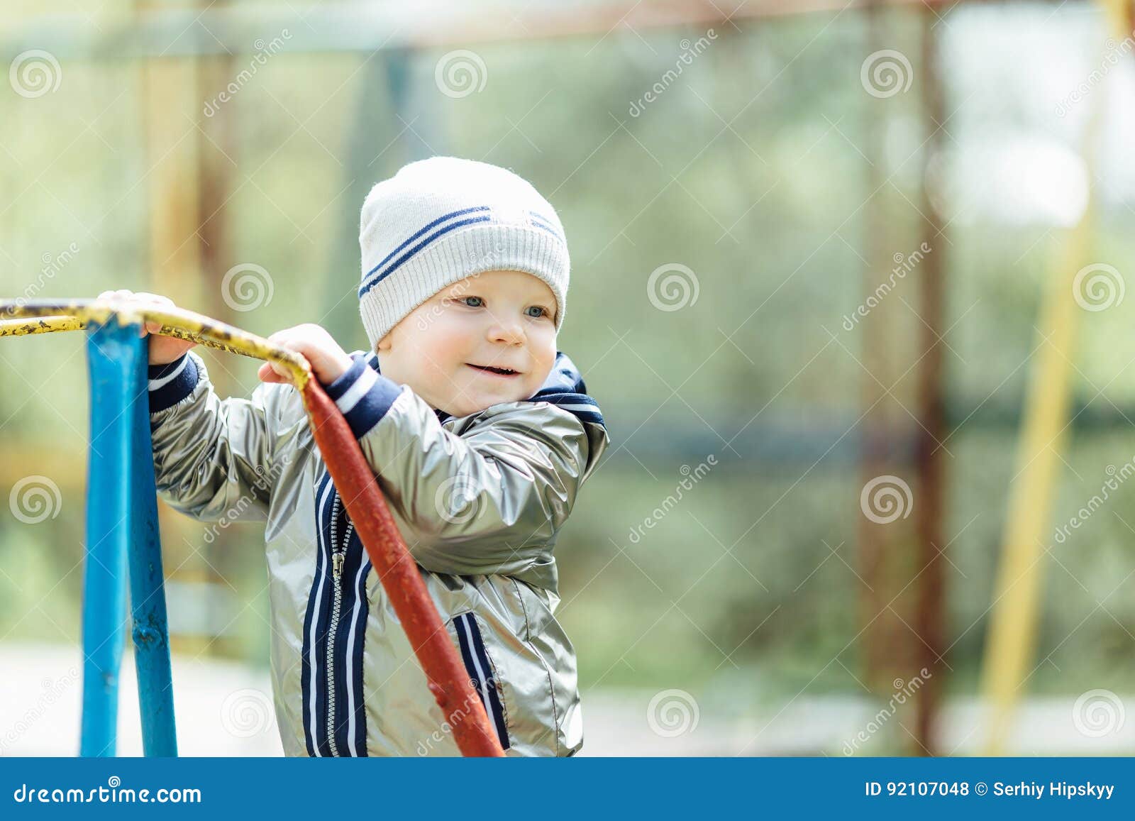 Little Boy Riding a Swing in Park Playground Stock Photo - Image of ...