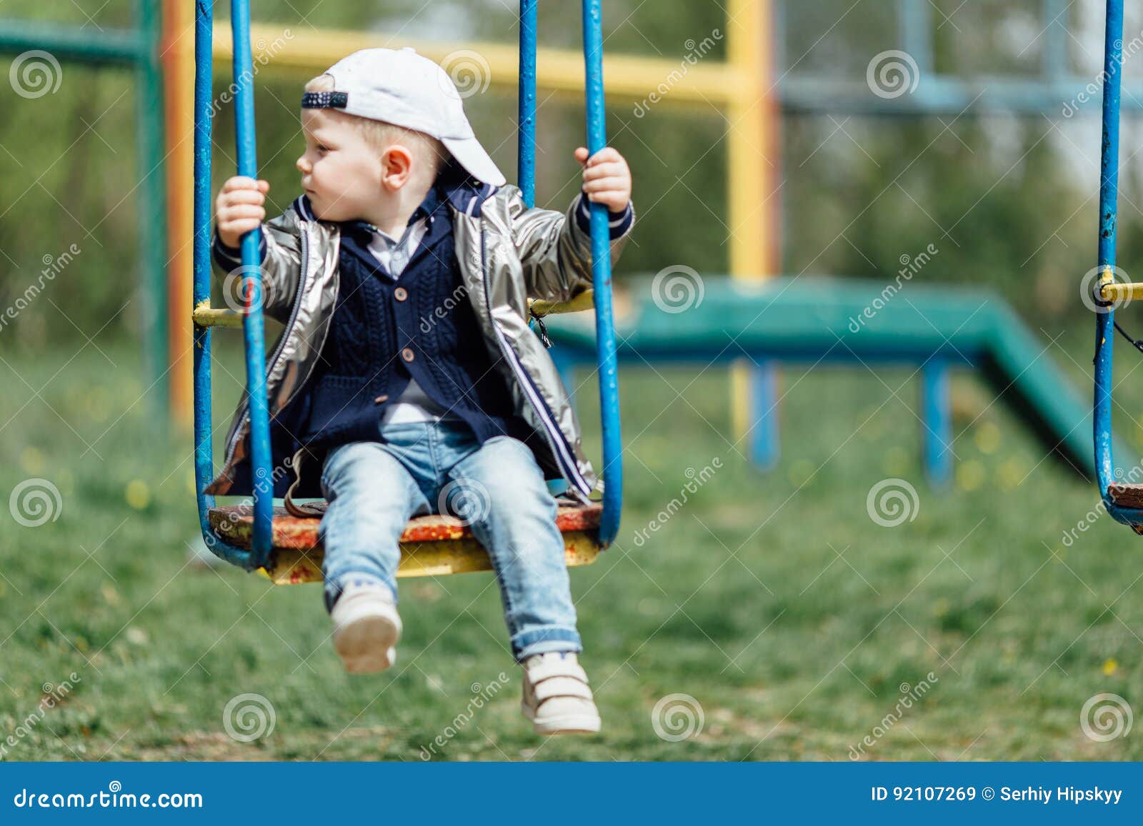 Little Boy Riding a Swing in Park Playground Stock Image - Image of ...