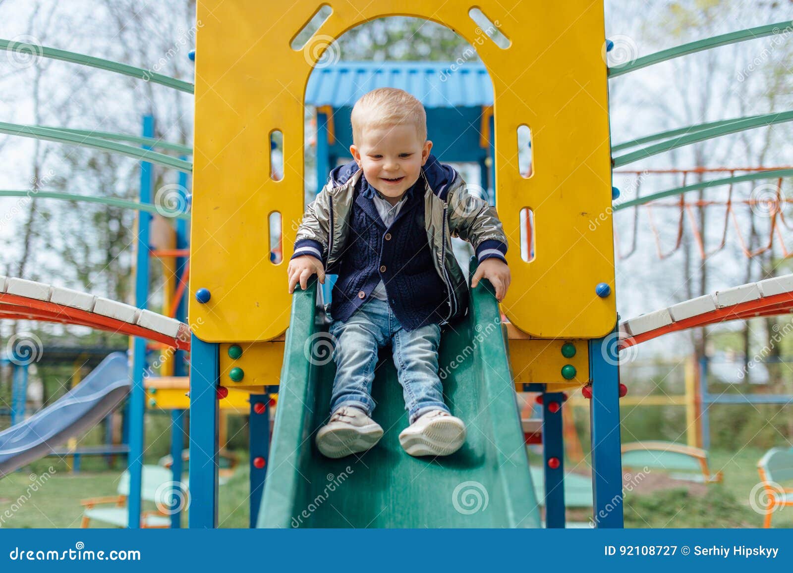 Little Boy Riding a Swing in Park Playground Stock Image - Image of ...
