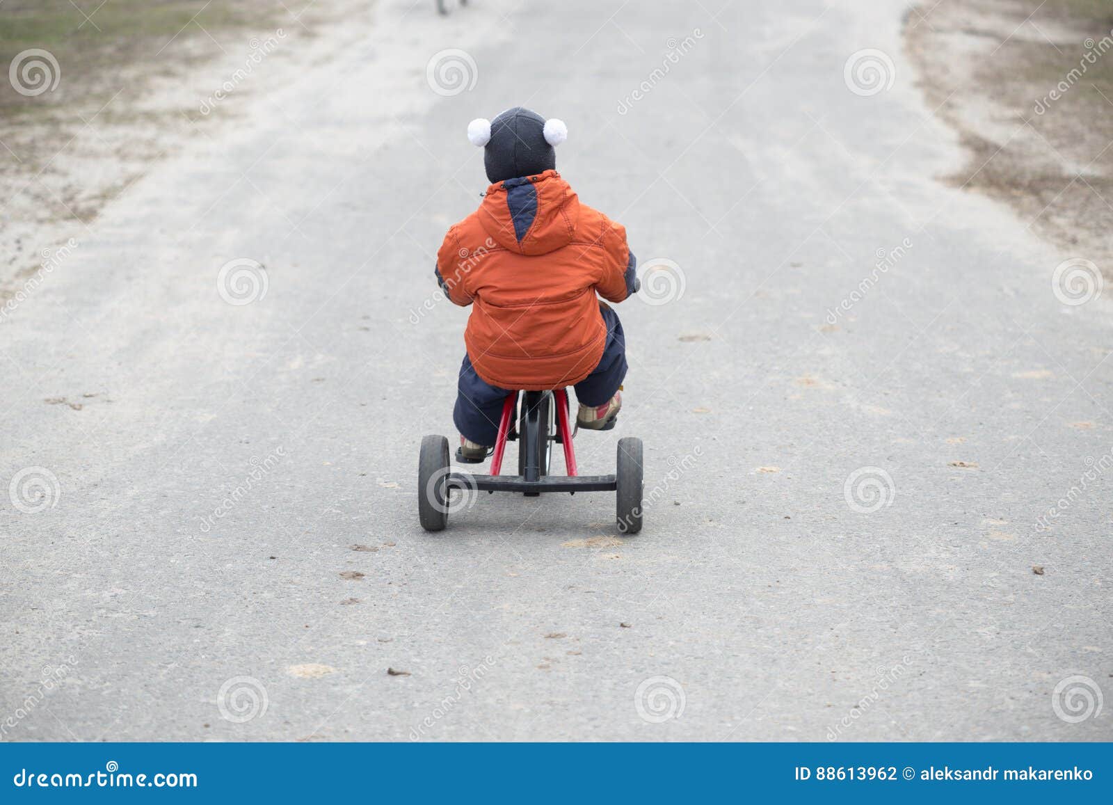 The Little Boy is Riding a Tricycle Stock Photo - Image of cute, biker ...