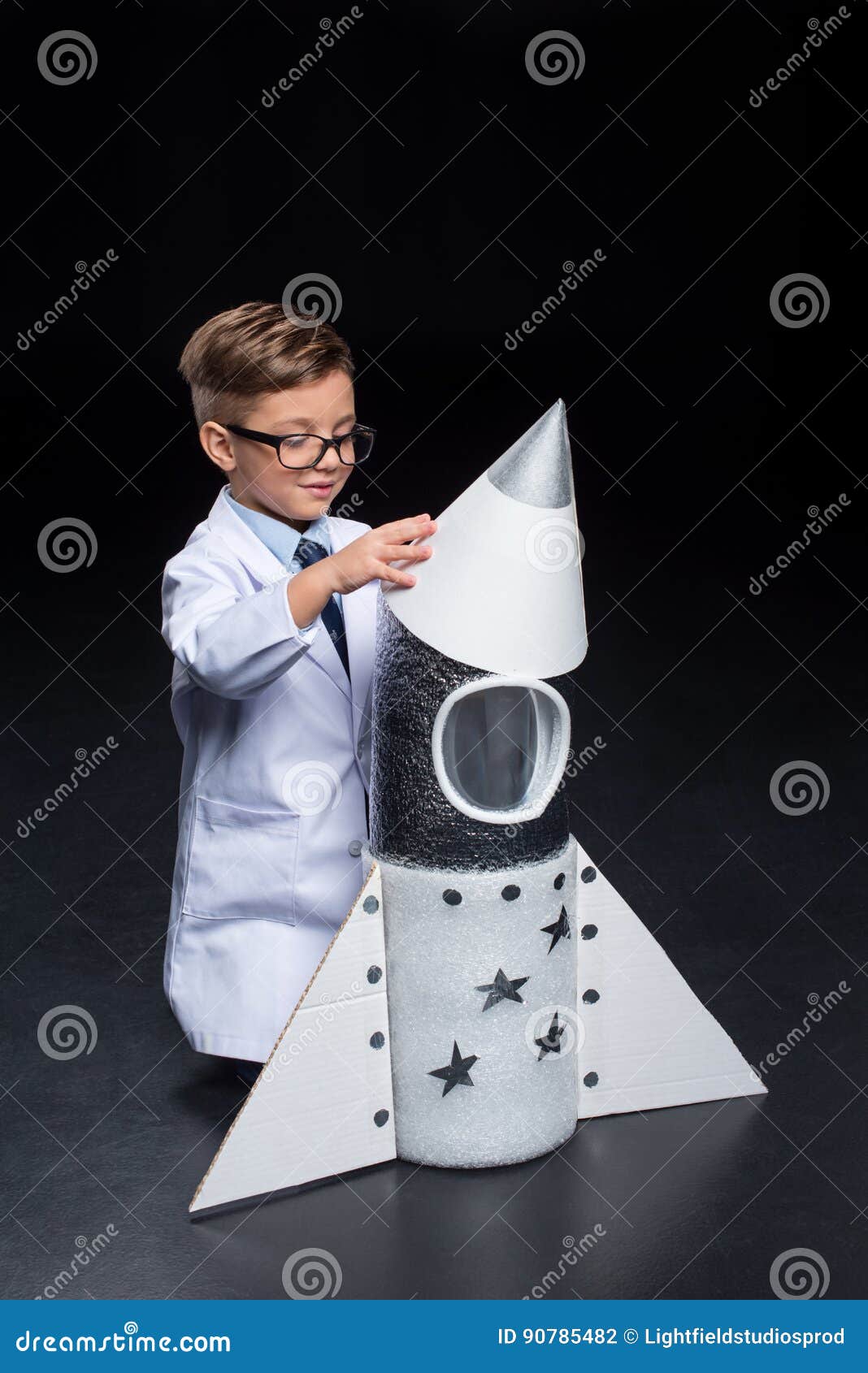 Little boy with rocket stock photo. Image of uniform - 90785482