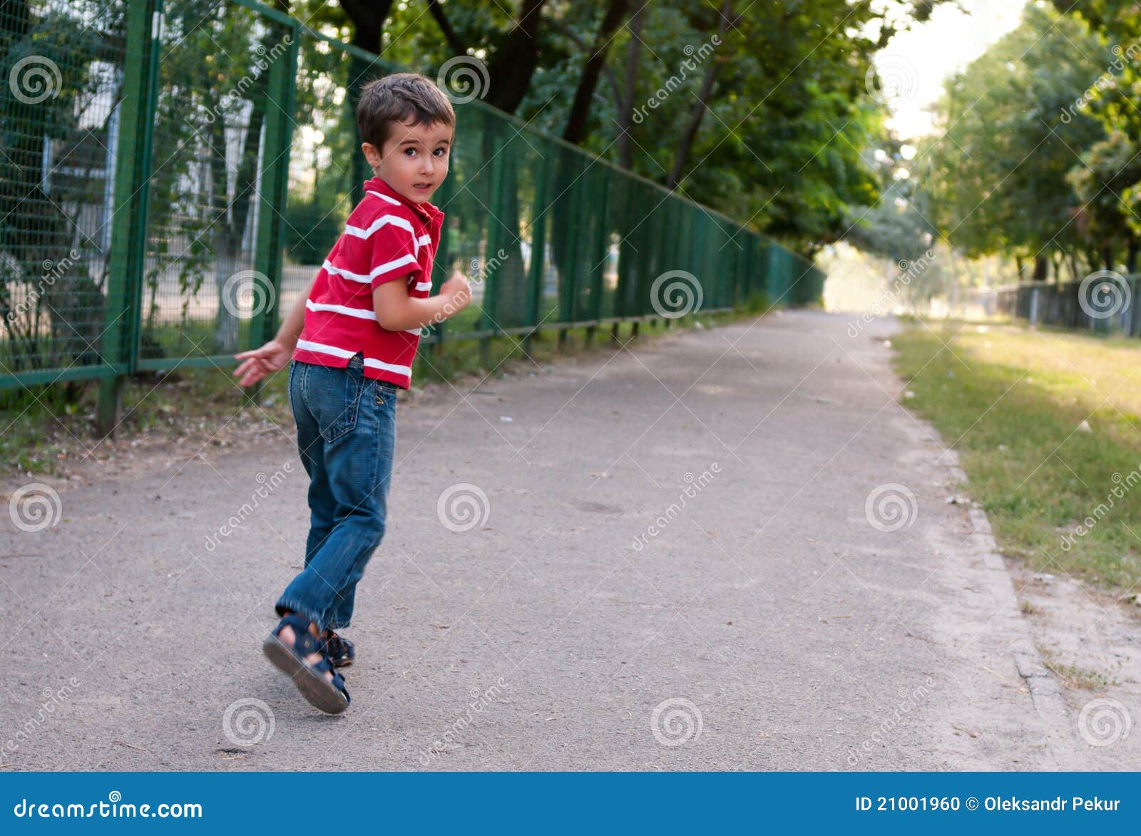 Little Boy Run by the Fence Stock Photo - Image of outdoors, caucasian ...