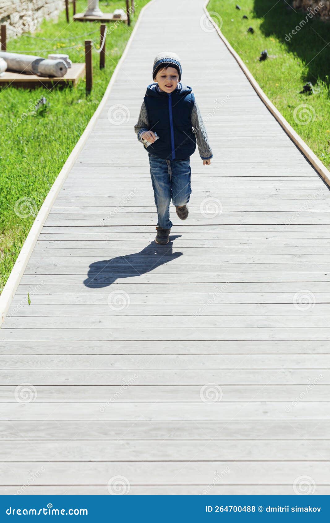 Little Boy Running Down the Road Playing in the Park Stock Photo ...