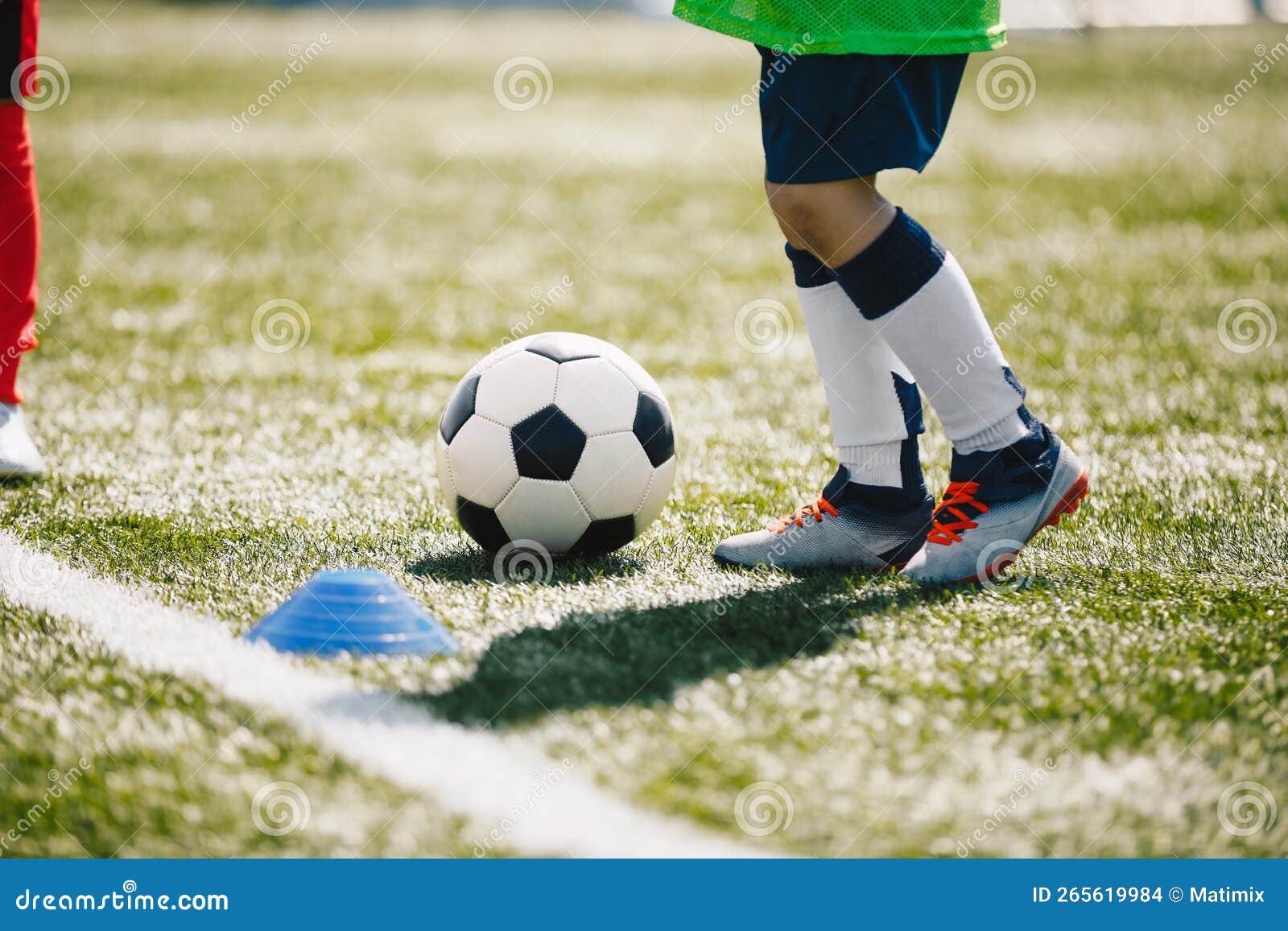 Little Boy Running and Kicking a Classic Soccer Ball on Training Class ...