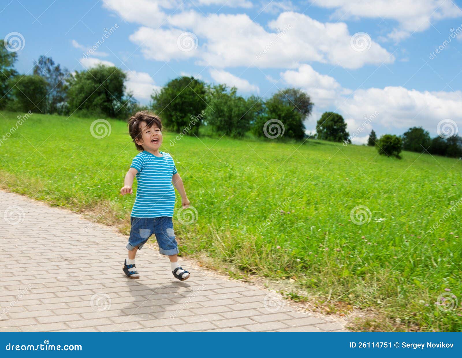 Little boy running in park stock image. Image of playing - 26114751