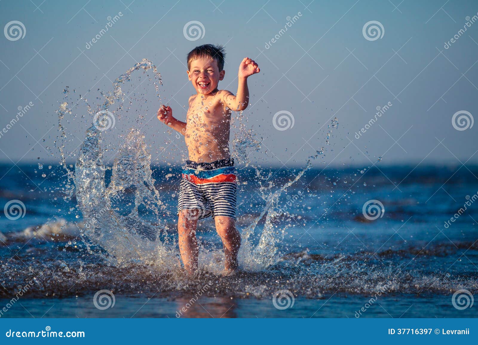Little Boy Running through the Water at Beach Stock Image - Image of ...