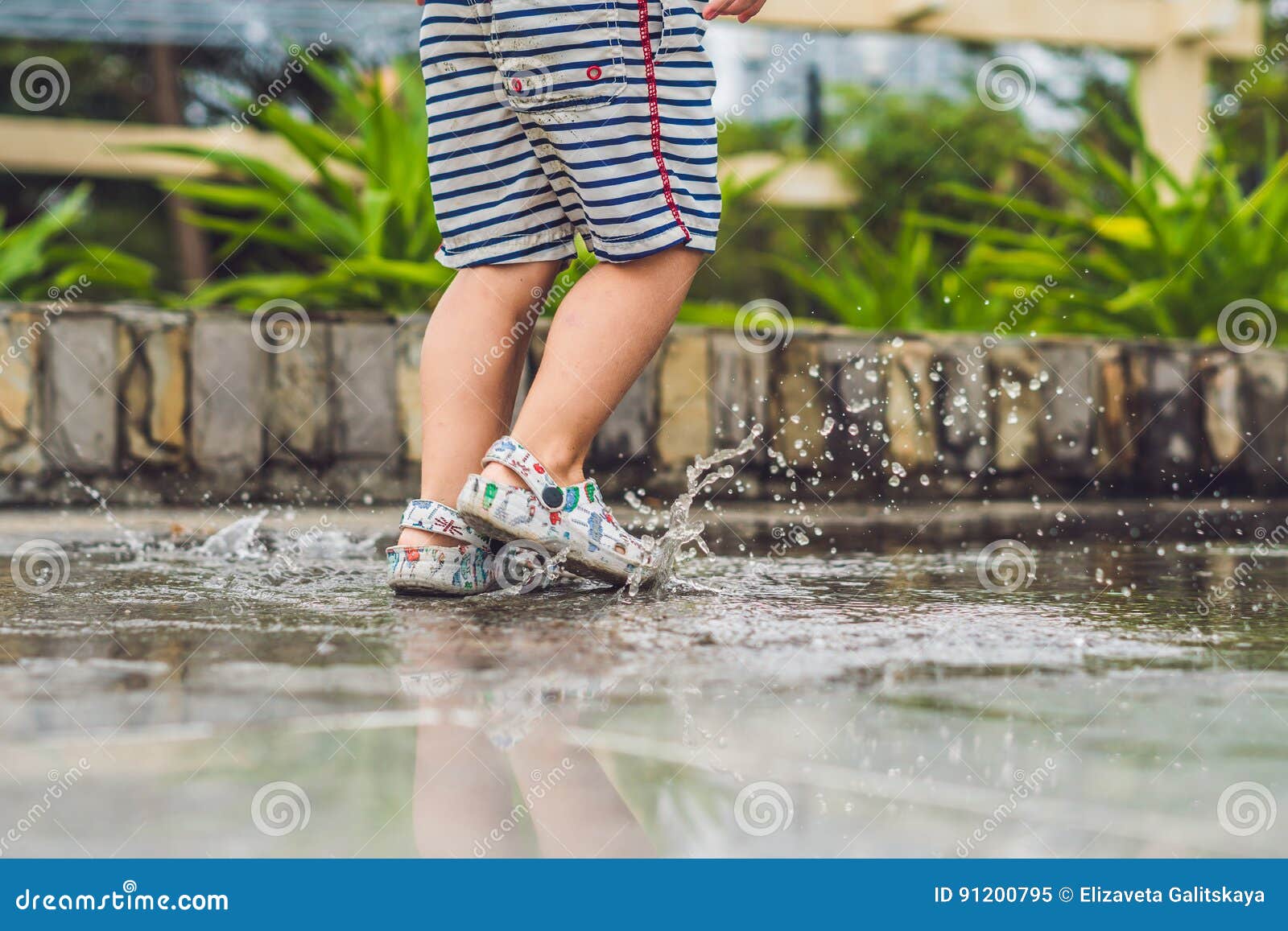Little Boy Runs through a Puddle. Summer Outdoor Stock Image - Image of ...