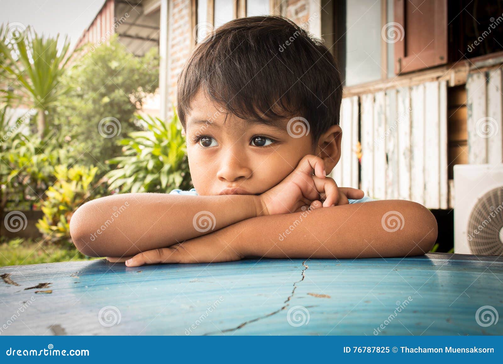 Little Boy Sad and Worried Lying on the Table Stock Image - Image of ...