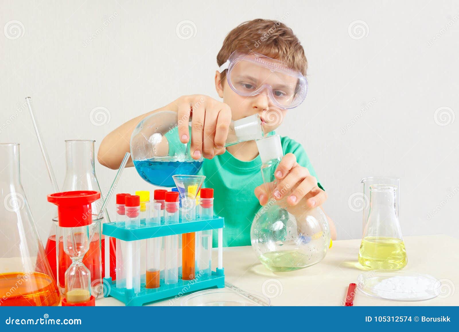 Little Boy in Safety Goggles Studies Chemical Practice in Laboratory ...
