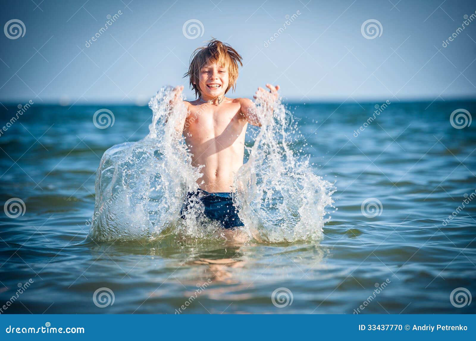 Little boy in the sea stock photo. Image of beautiful - 33437770