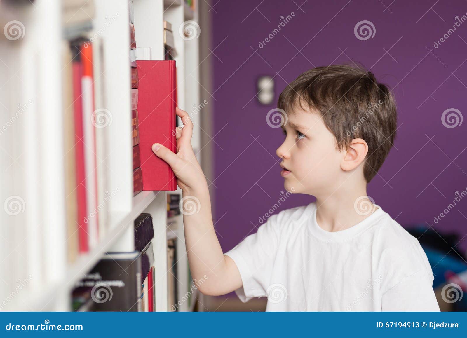 Little Boy Selecting Book from Library. Stock Image - Image of bookcase ...