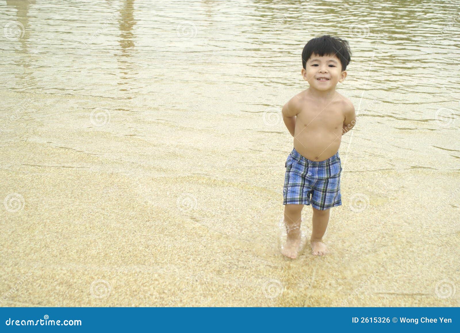 Little Boy in Shallow Water Stock Photo - Image of walking, brother ...