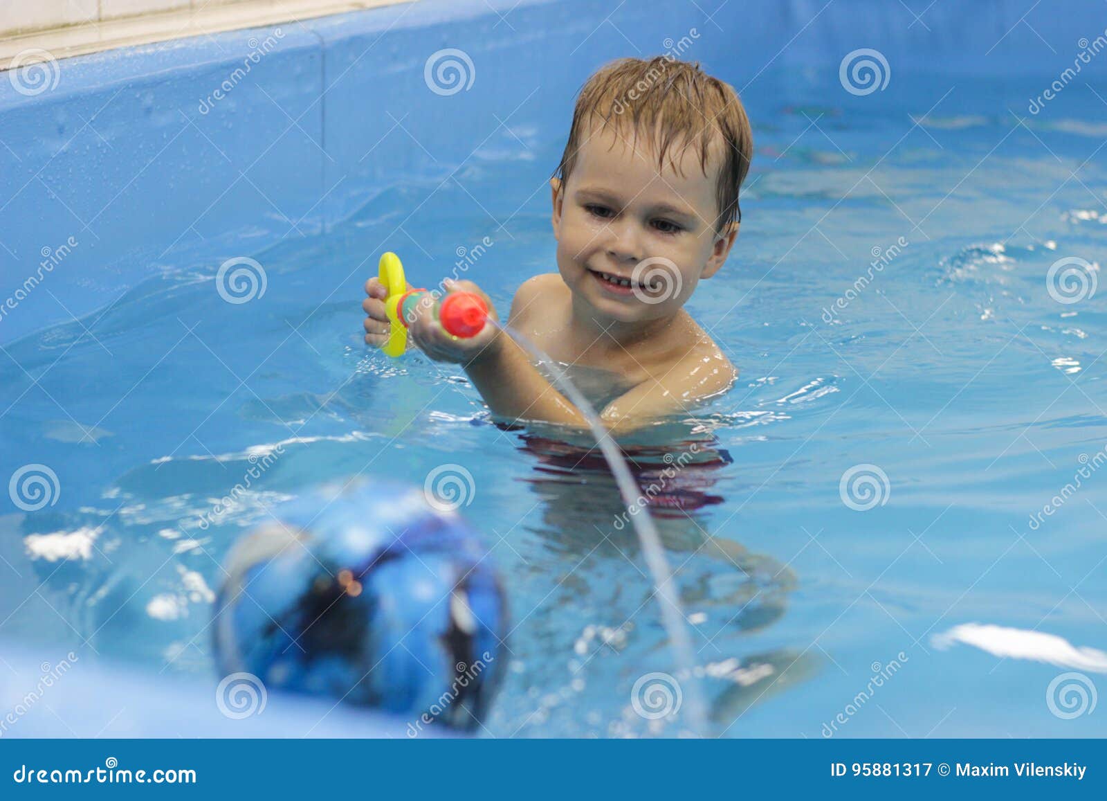 Little Boy Shooting with Water Gun in the Pool Stock Image - Image of ...