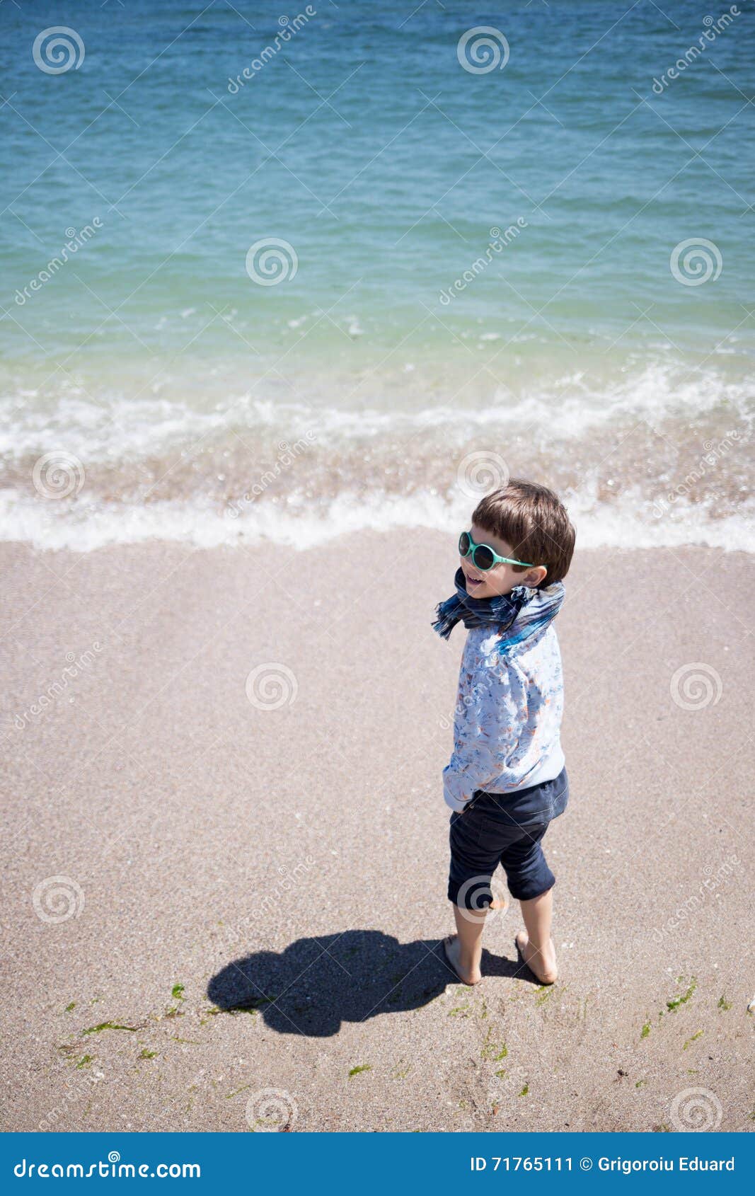 Little boy at the shore stock image. Image of water, head - 71765111