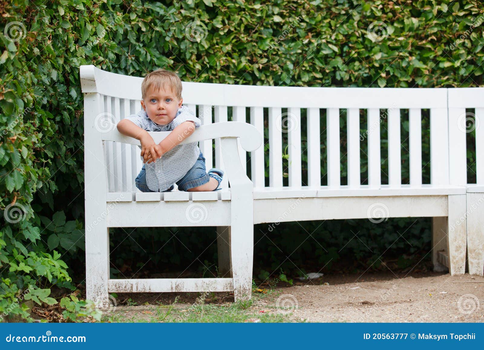 Little Boy Sits On A Bench In A Park Stock Image - Image of adorable ...