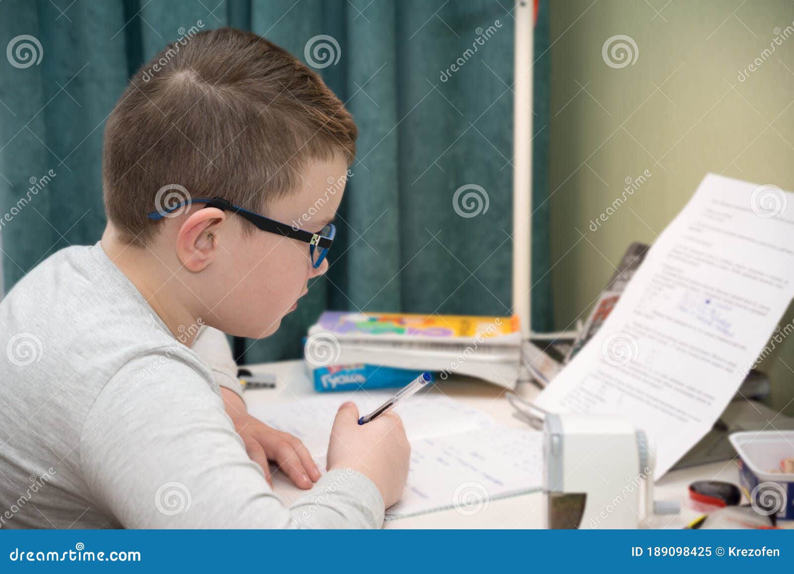 Little boy sits at a table stock image. Image of happy - 189098425