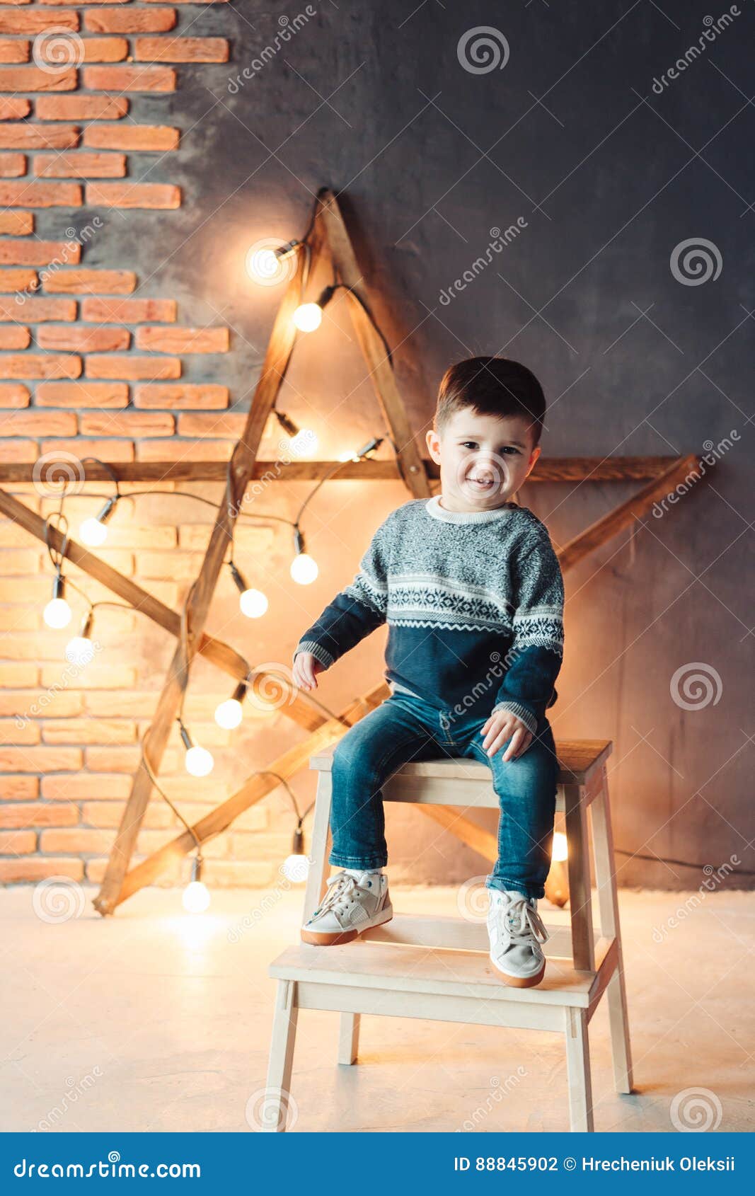Little Boy Sitting on a Chair Stock Photo - Image of happy, attractive ...